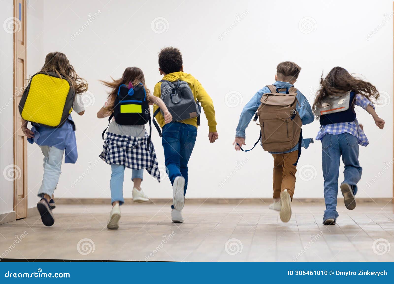 Group of Elementary School Kids Running in School Corridor. Stock Photo ...