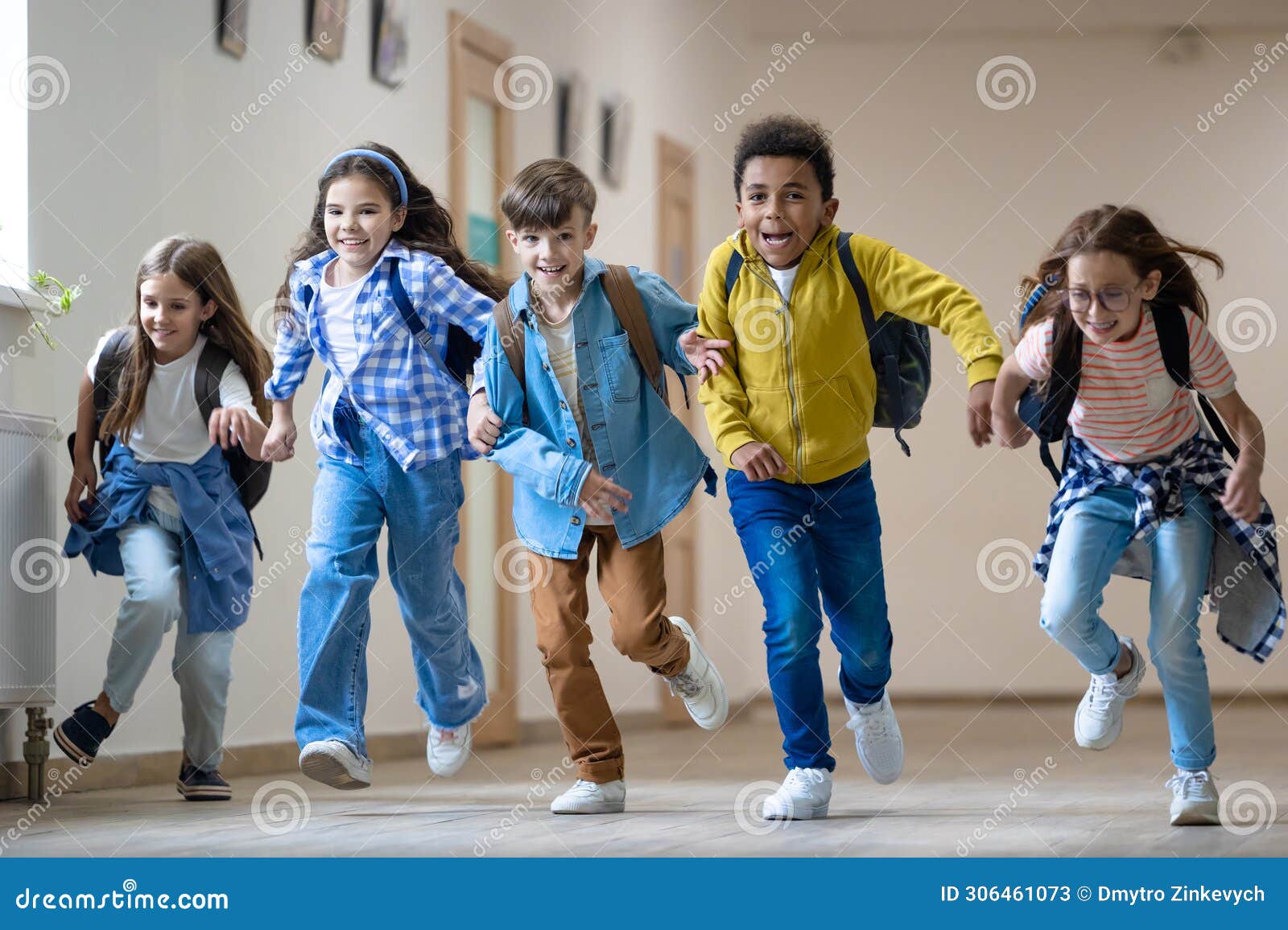 Group of Elementary School Kids Running in School Corridor. Stock Image ...