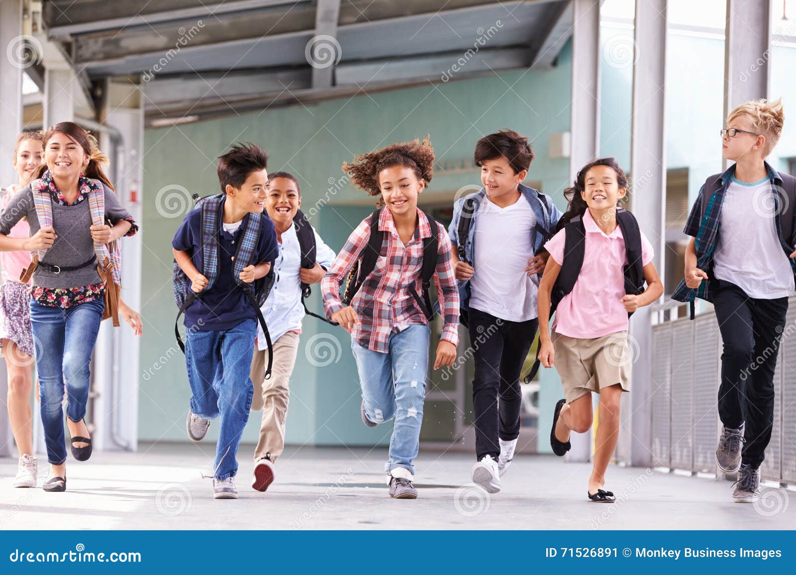Group of Elementary School Kids Running in a School Corridor Stock ...
