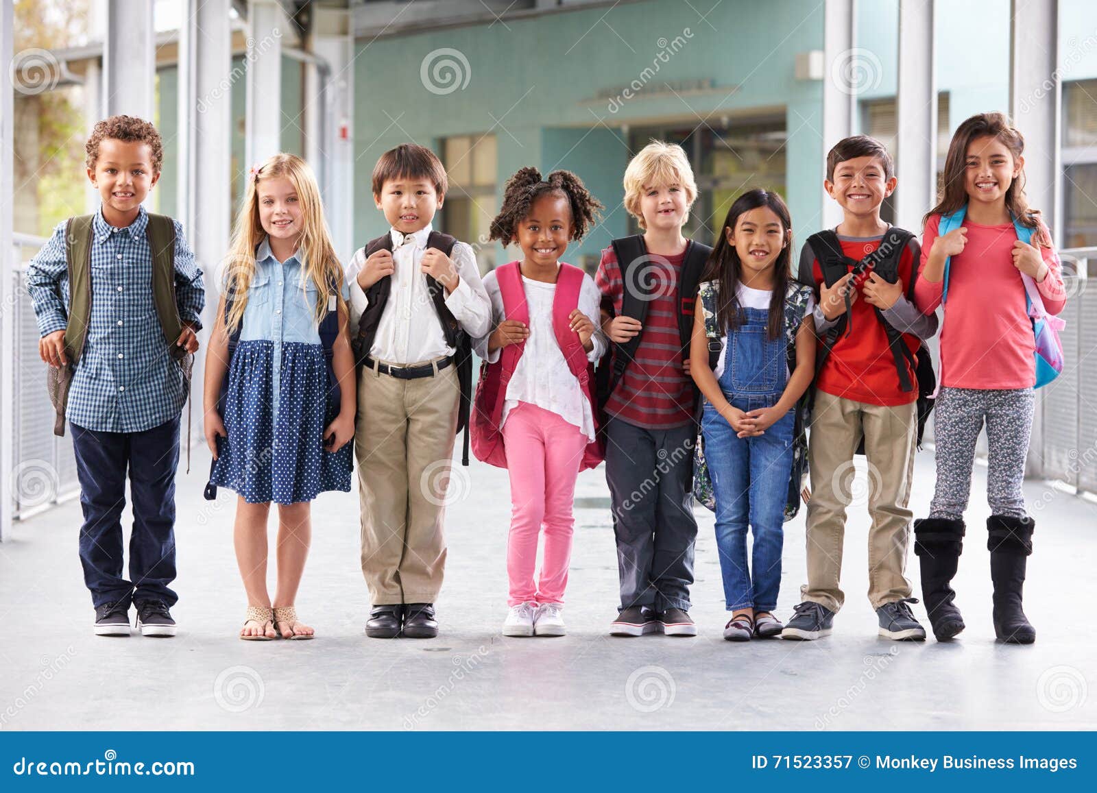 Group of Elementary School Kids Standing in School Corridor Stock Image ...