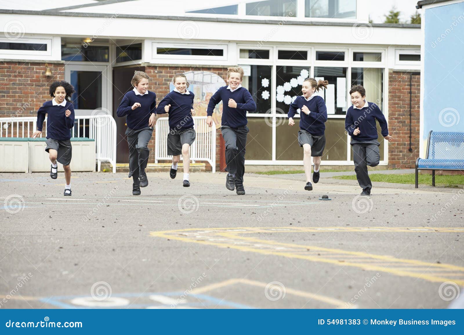 Group of Elementary School Pupils Running in Playground Stock Image ...