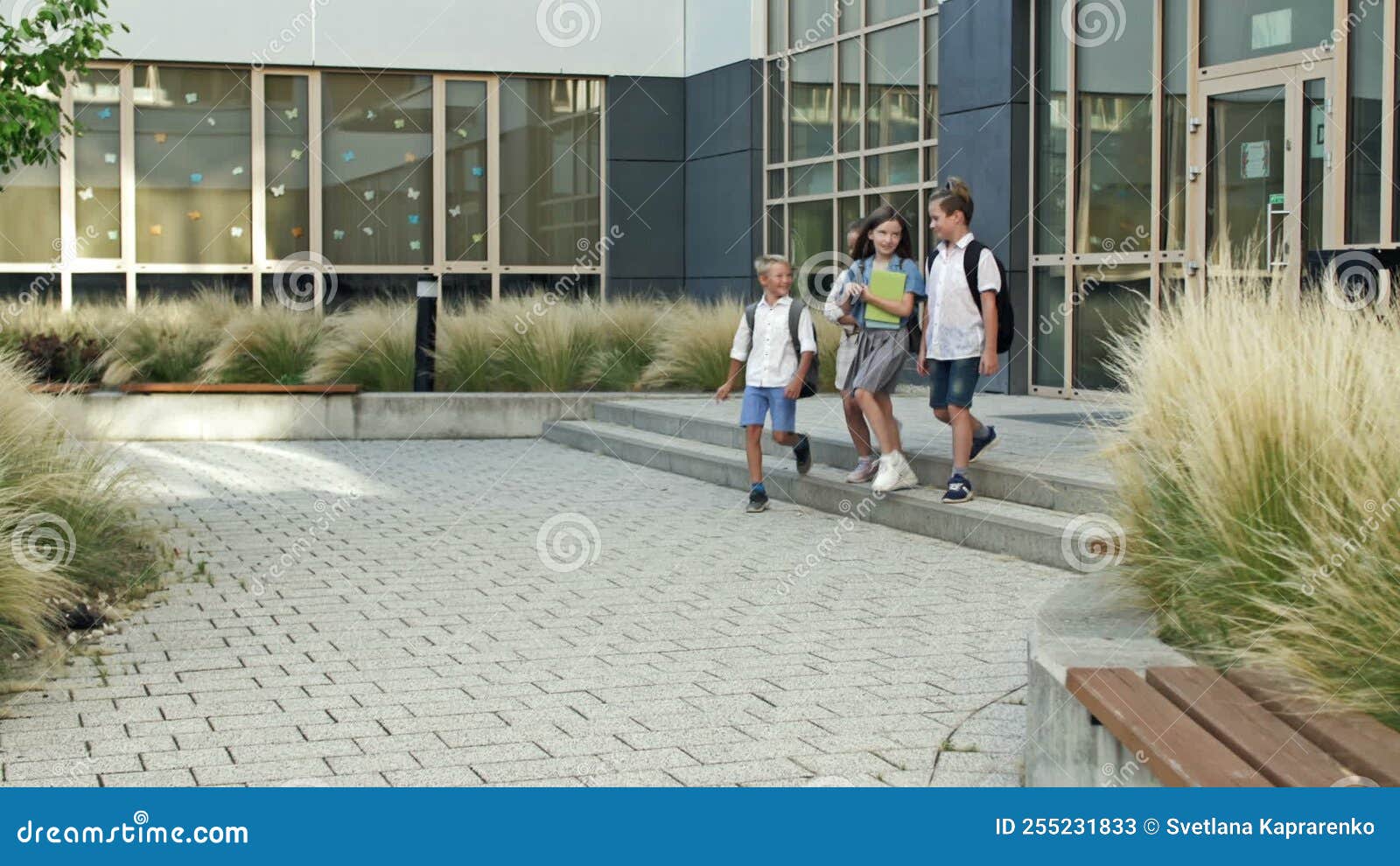 Group of Elementary School Students Joyfully Run Out of the School ...