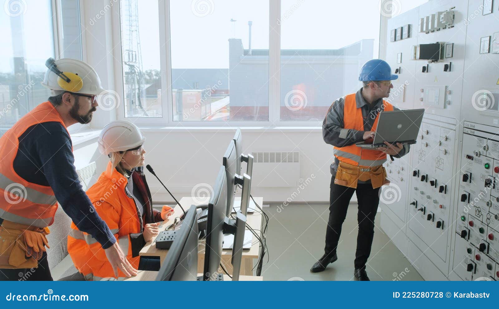 Group of Employees Checks Equipment Data in Control Room Stock Photo ...