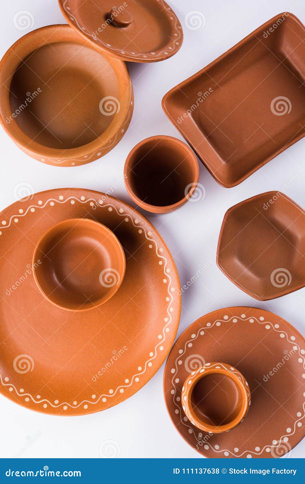 Group of Empty Terracotta Dinnerware or Dining Set Stock Photo - Image ...