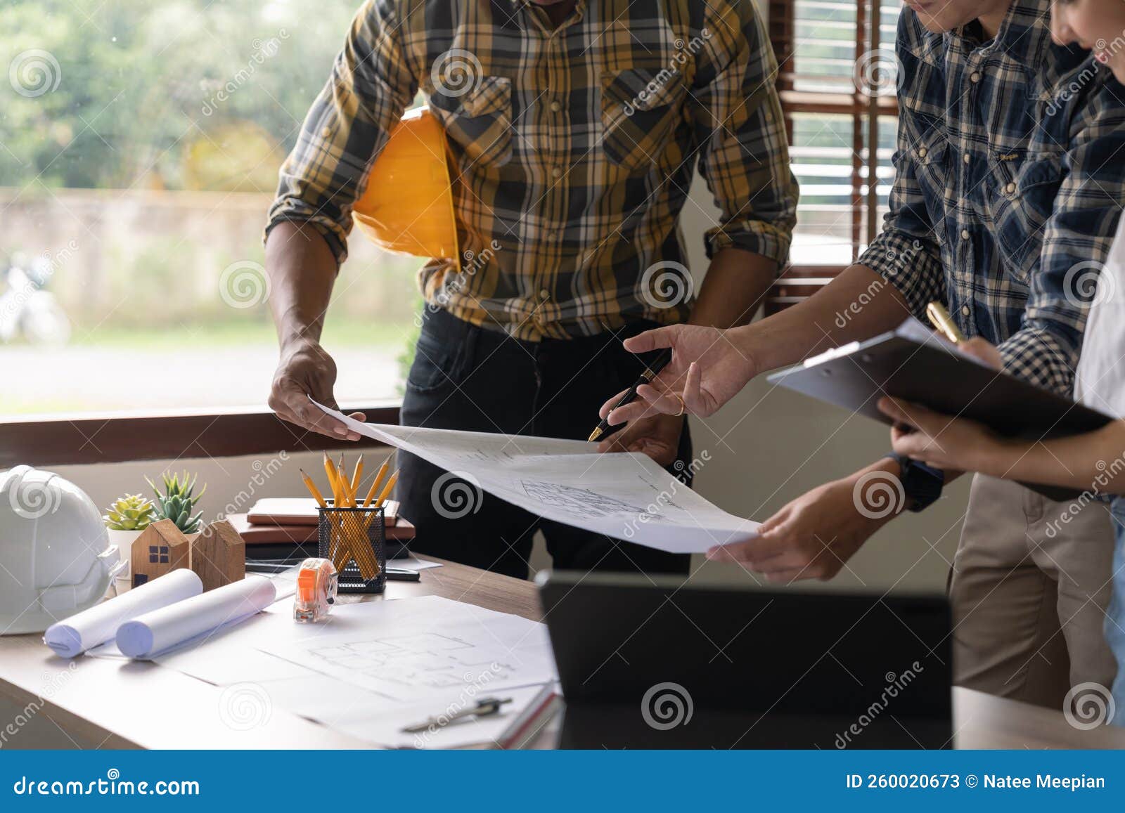 Group of Engineer and Architect Working in Office with Blueprints ...