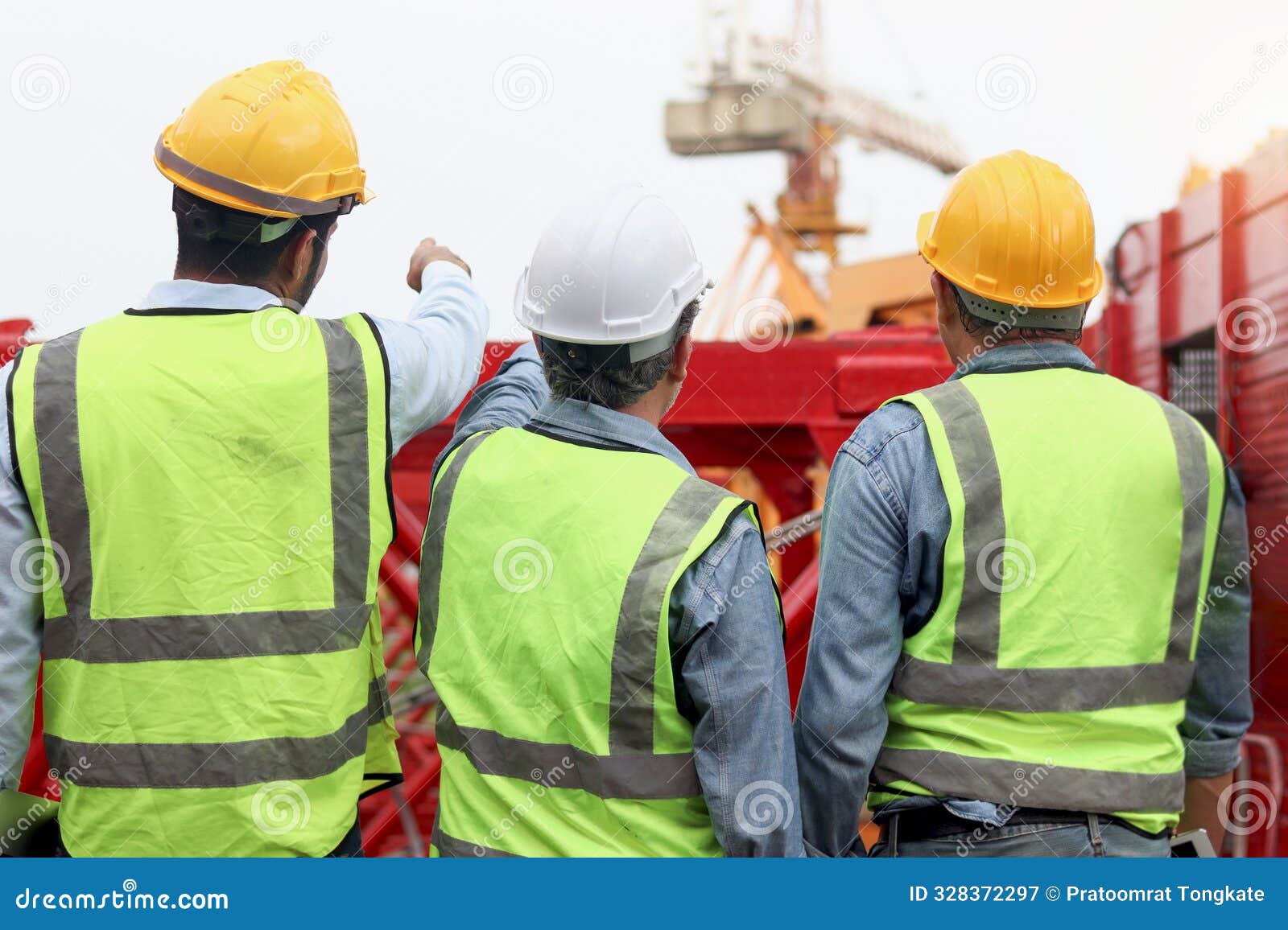 Group of Engineer Workers with Safety Vest and Helmet from Behind ...