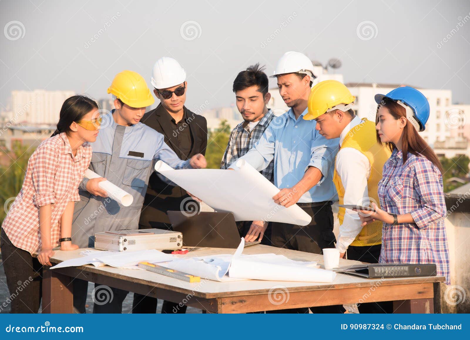 Group Of Engineers And Architects Discuss At A Construction Site Stock ... Group Of Engineers And Architects Discuss At A Construction Site Stock ...
