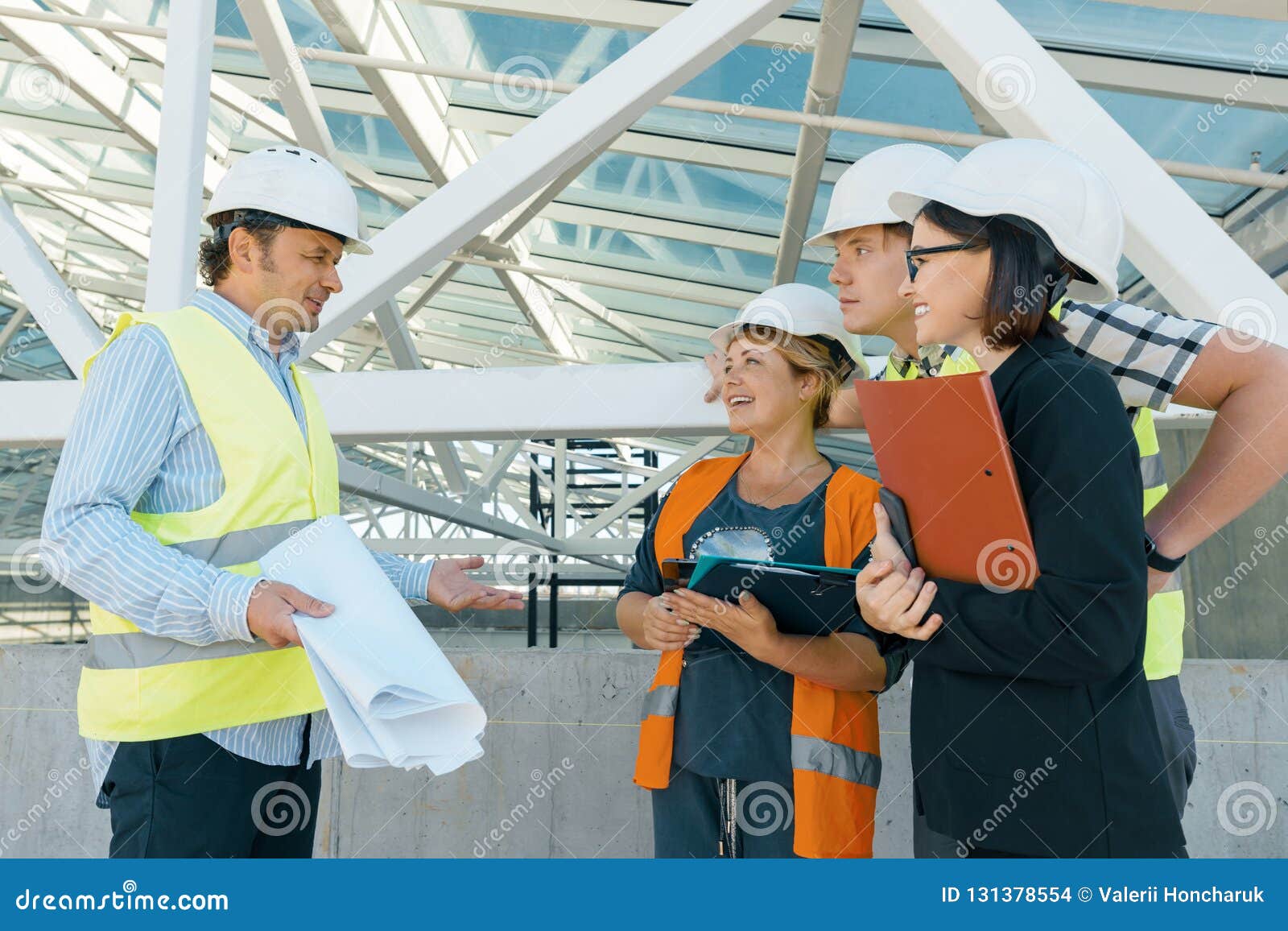 Group of Engineers, Builders, Architects on the Building Site ...