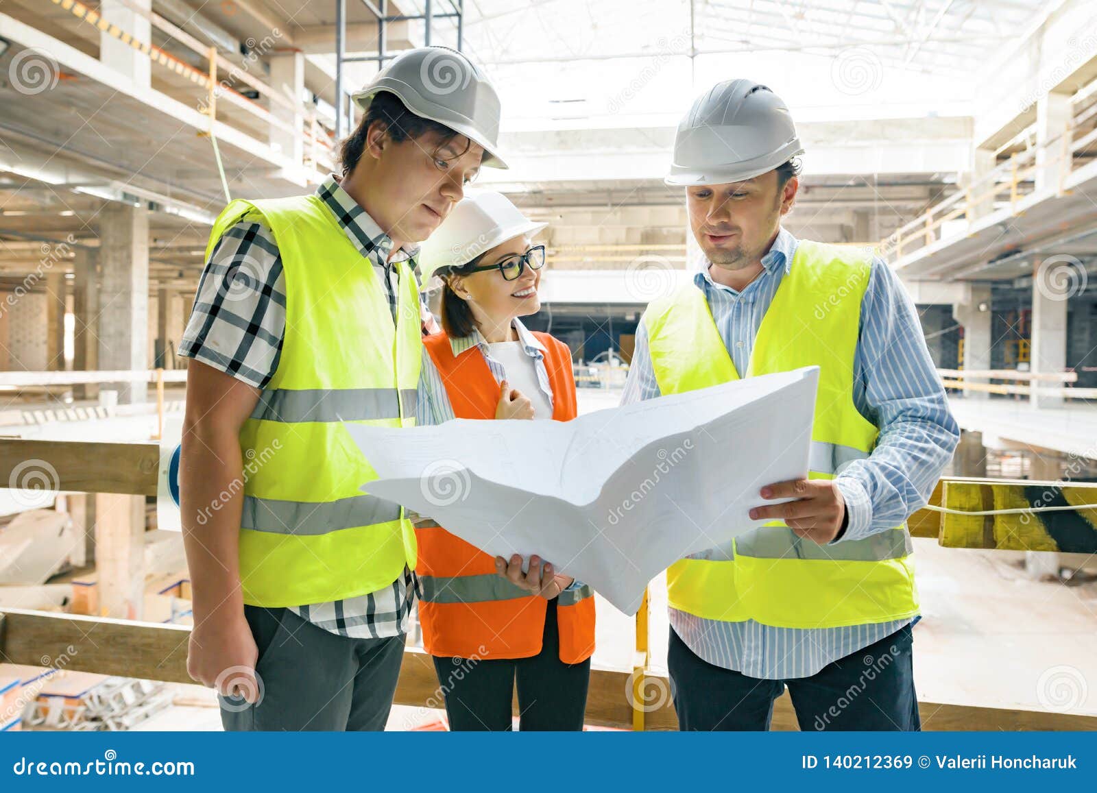 Group of Engineers, Builders, Architects on the Building Site, Looking ...