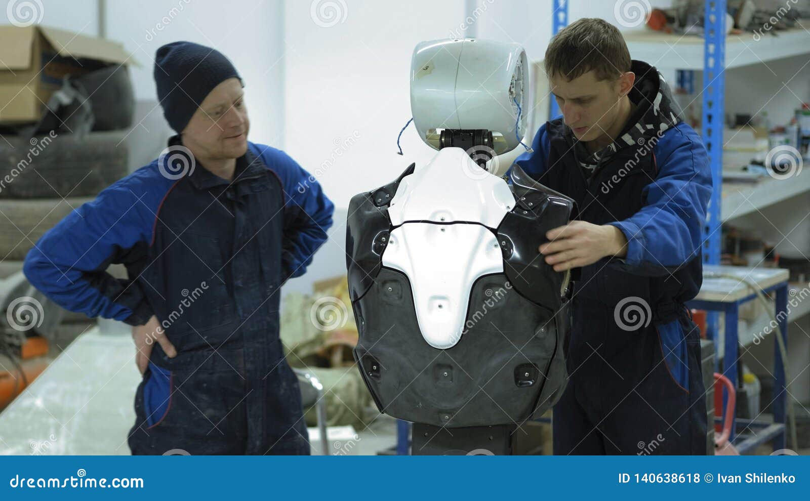 A Group of Engineers Creates a Modern Robot or Android. Check and ...