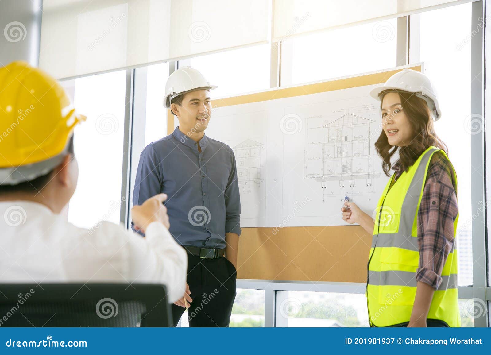 Group of Engineers Discussion and Presenting Blueprint on Board at ...