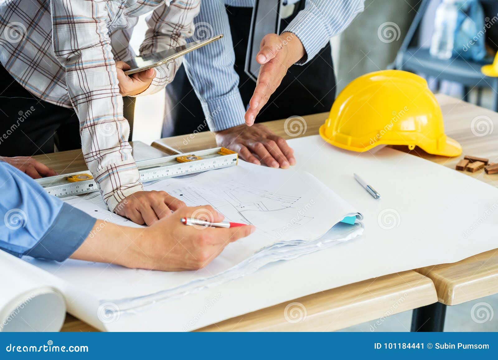 Group of Engineers are Looking at a Blueprint for Construction Stock ...