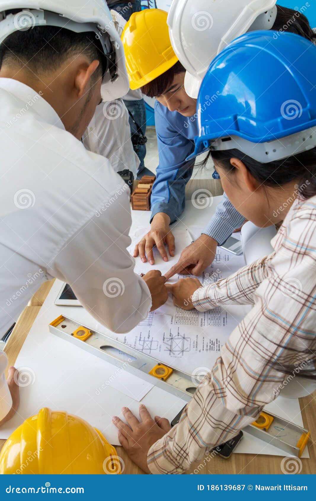 A Group of Engineers are Looking at a Blueprint for Construction Stock ...