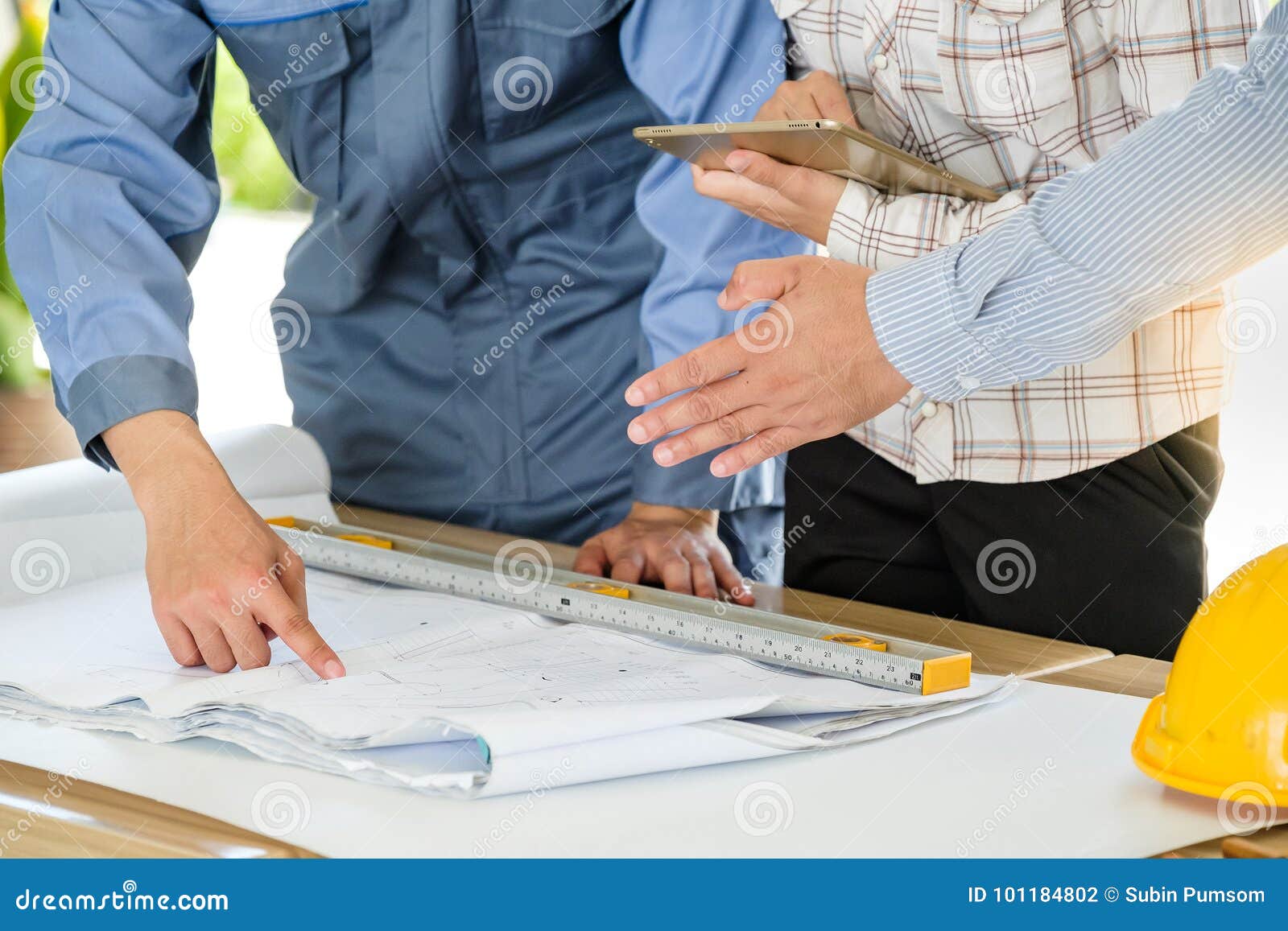 Group of Engineers are Looking at a Blueprint for Construction Stock ...