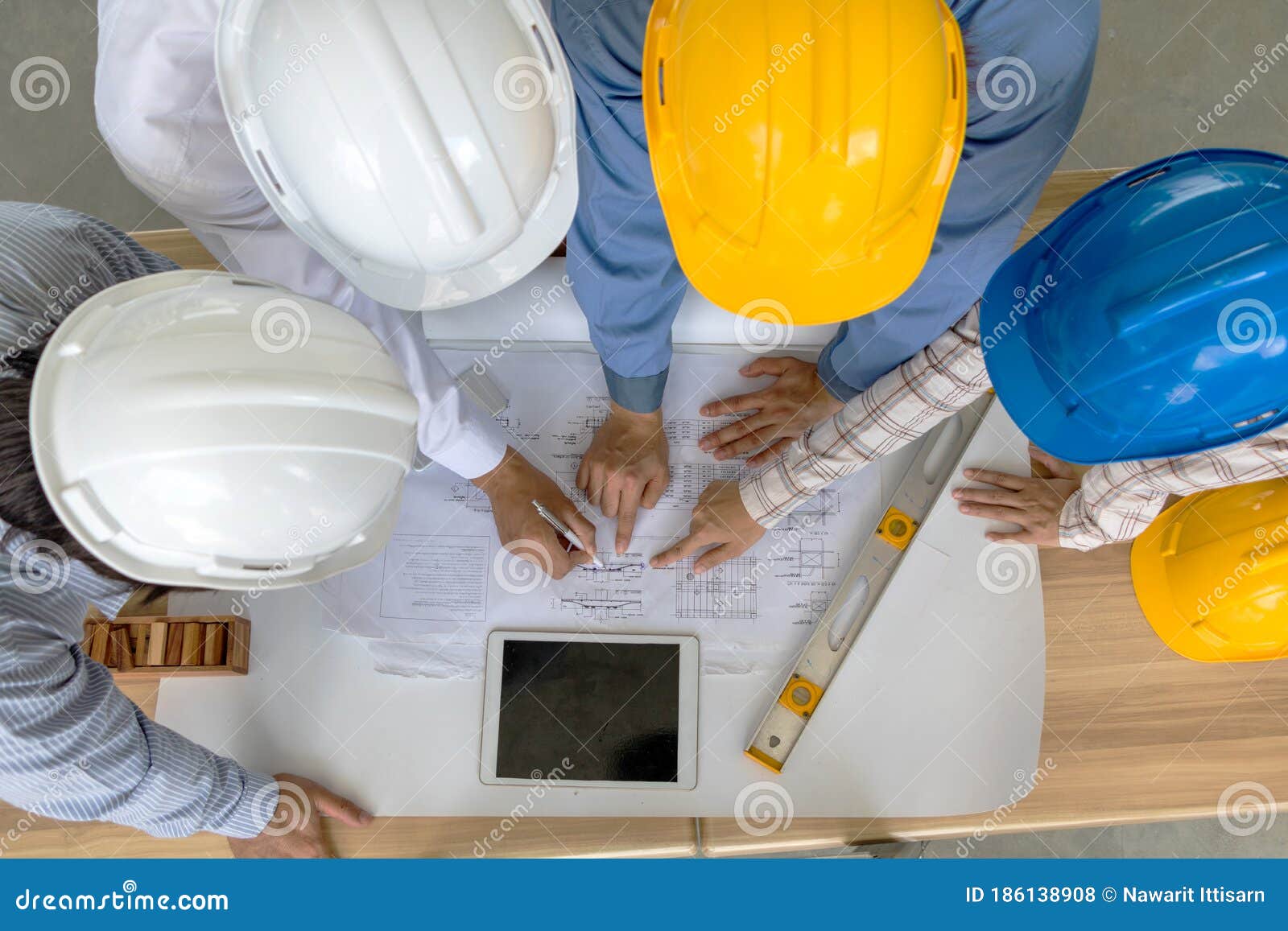 A Group of Engineers are Looking at a Blueprint for Construction Stock ...