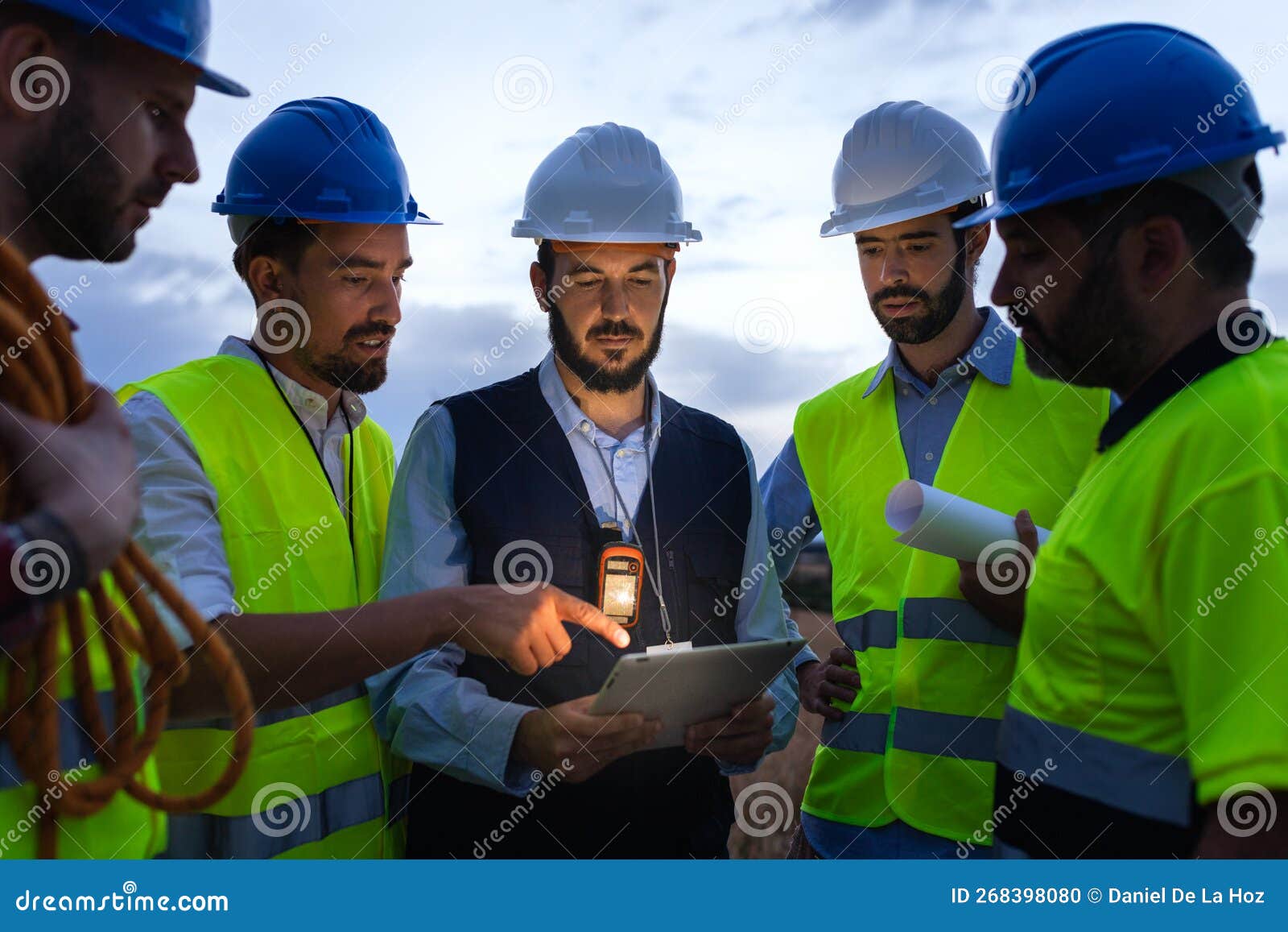 Group of Engineers and Maintenance Workers Looking at Digital Tablet ...