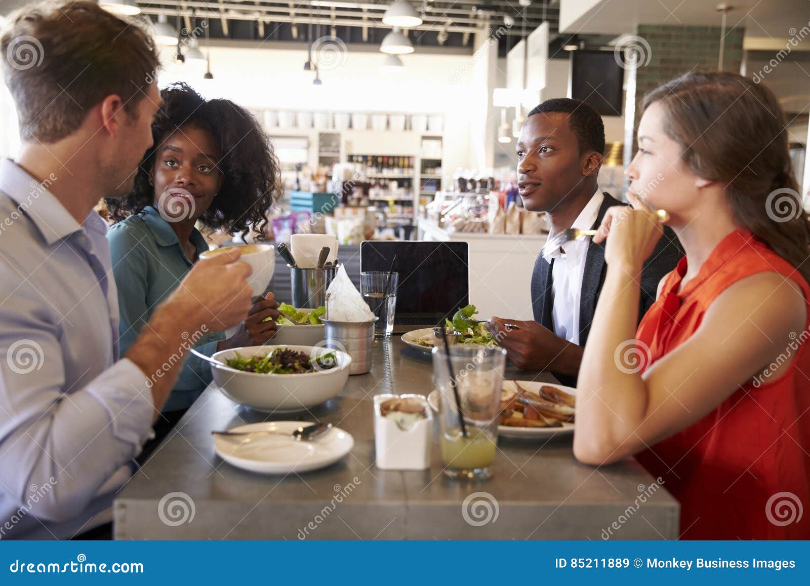 Group Enjoying Business Lunch in Delicatessen Stock Image - Image of ...