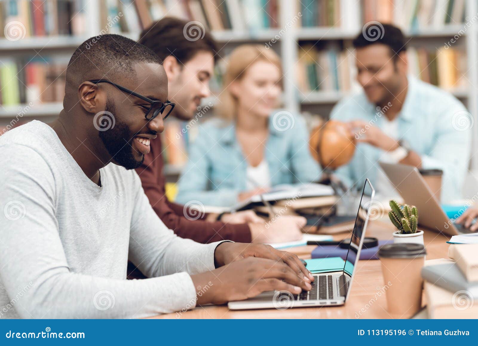 Group of Ethnic Multicultural Students in Library. Students are ...
