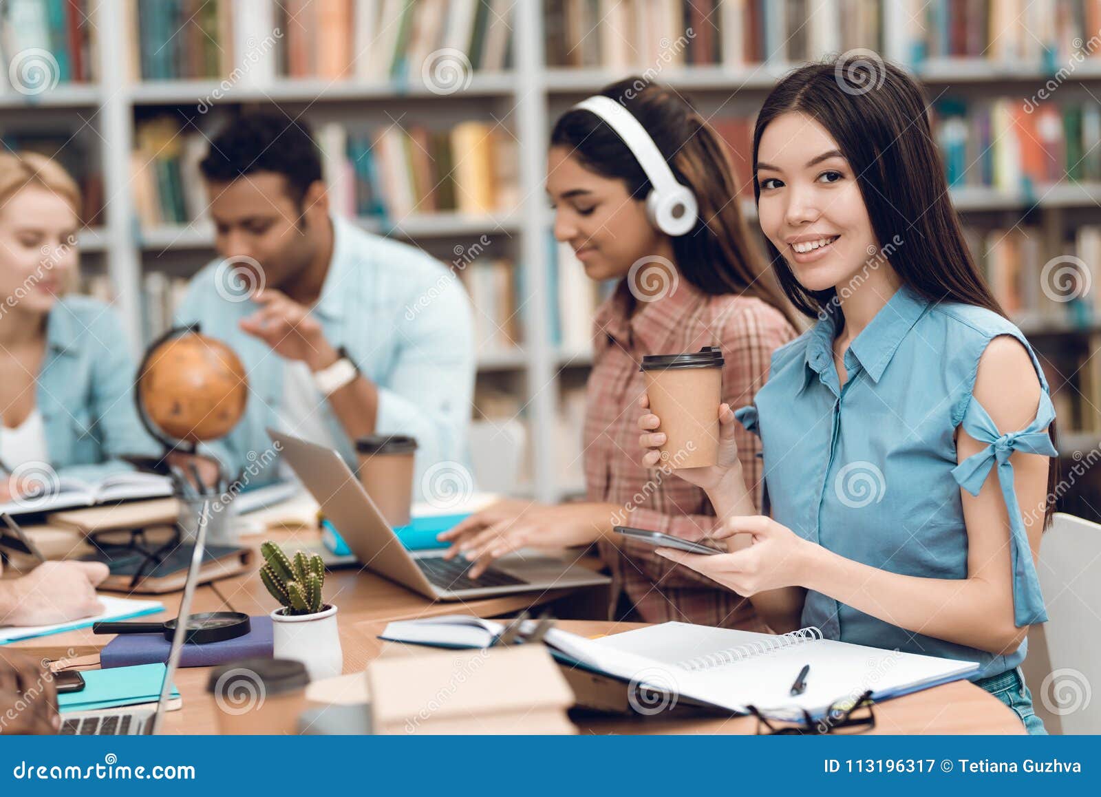 Group of Ethnic Multicultural Students in Library. Students are ...