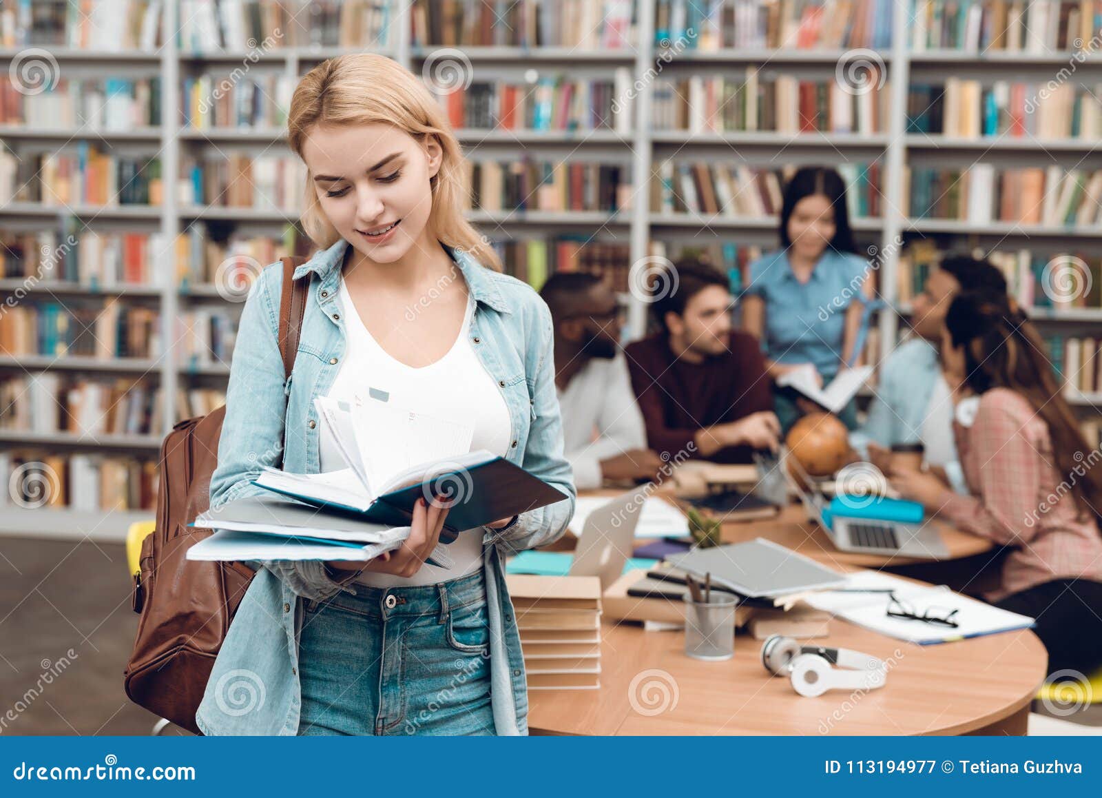 Group of Ethnic Multicultural Students in Library. White Girl Reading ...