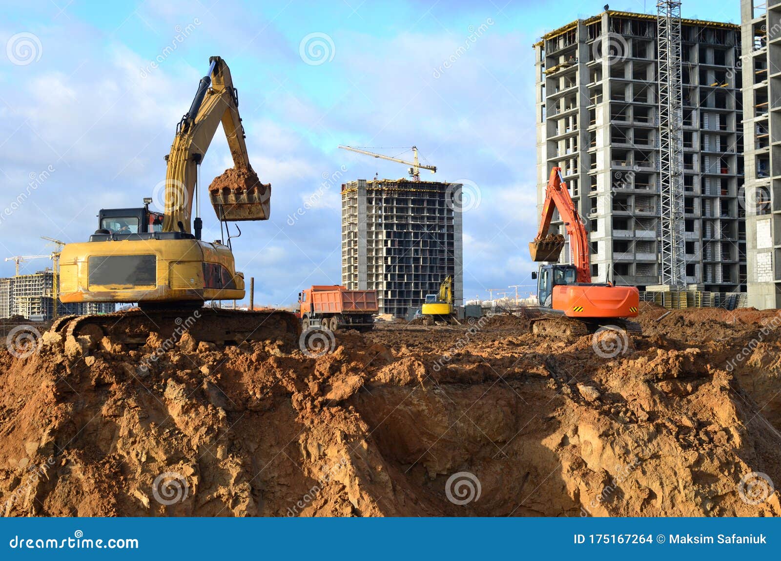 Group of the Excavators for Dig Ground Trenching at a Construction Site ...