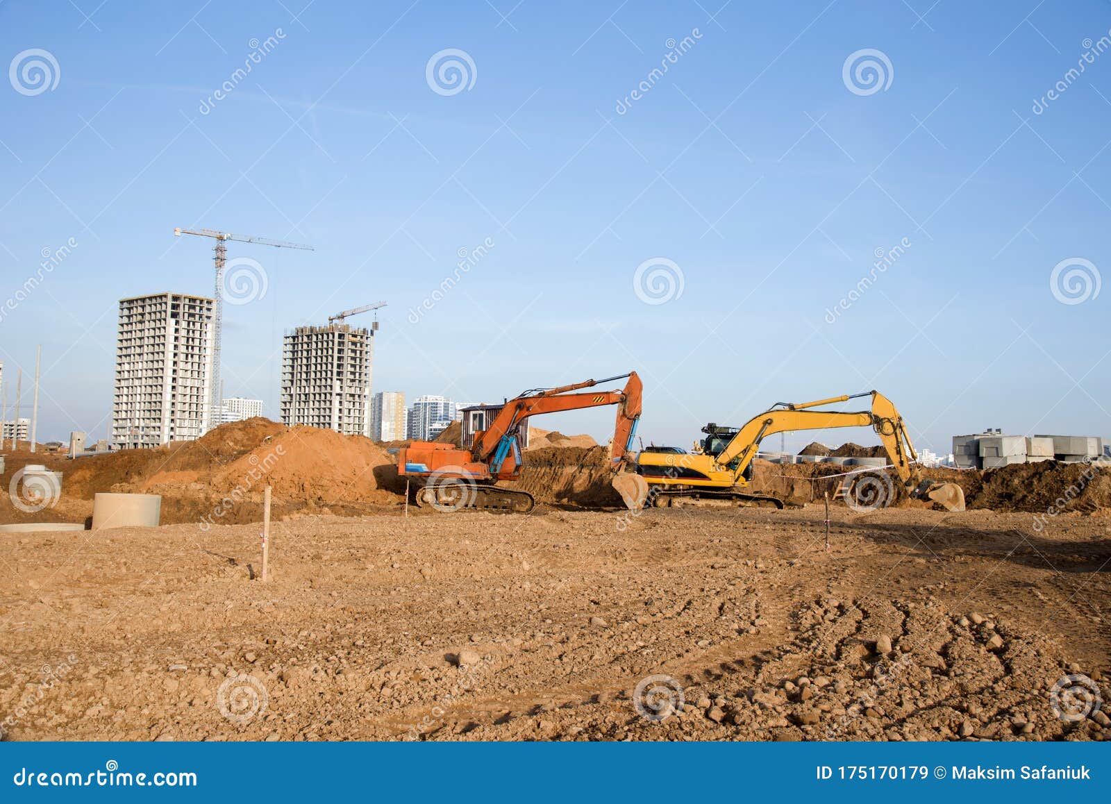 Group of the Excavators for Dig Ground Trenching at a Construction Site ...