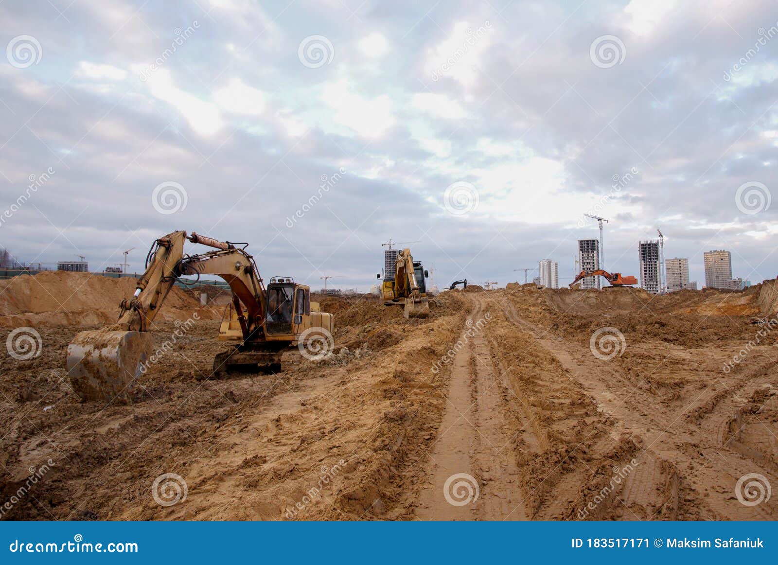 Group of the Excavators for Dig Ground Trenching at a Construction Site ...