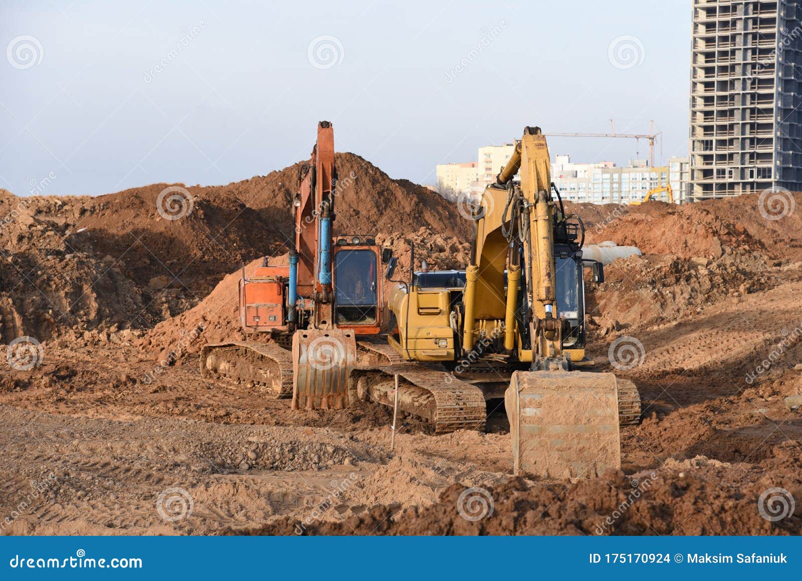 Group of the Excavators for Dig Ground Trenching at a Construction Site ...