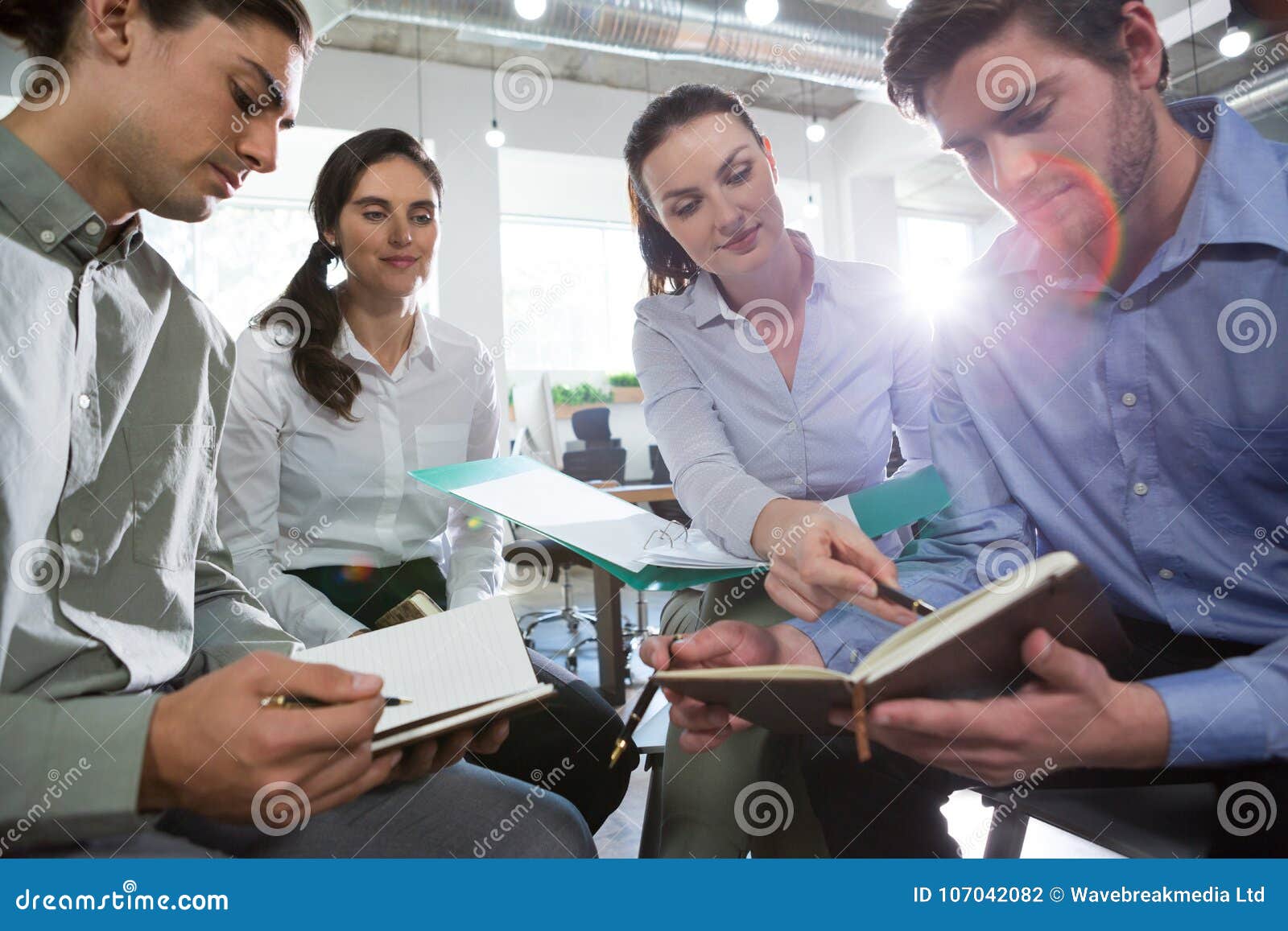 Group of Executive Discussing Over a Diary Stock Photo - Image of ...