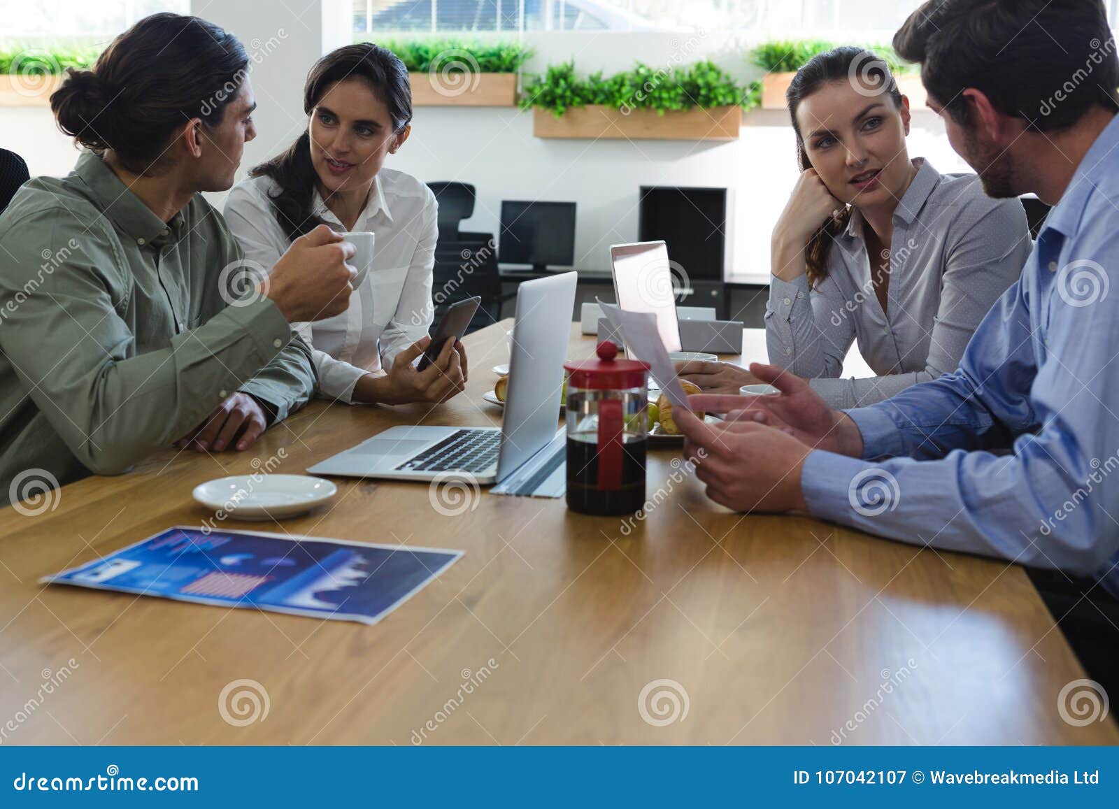 Group of Executives Discussing a Project at Desk Stock Image - Image of ...