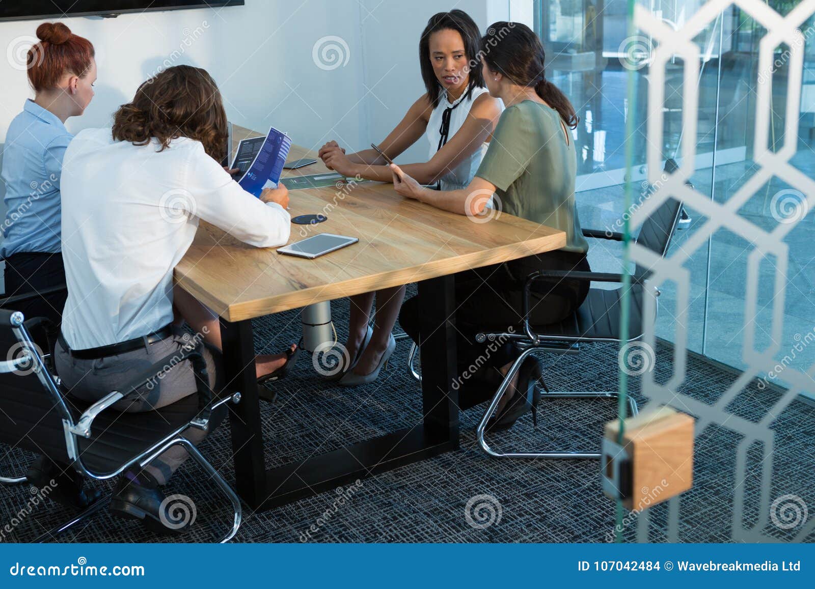 Group of Executives Discussing while Working at the Desk Stock Photo ...
