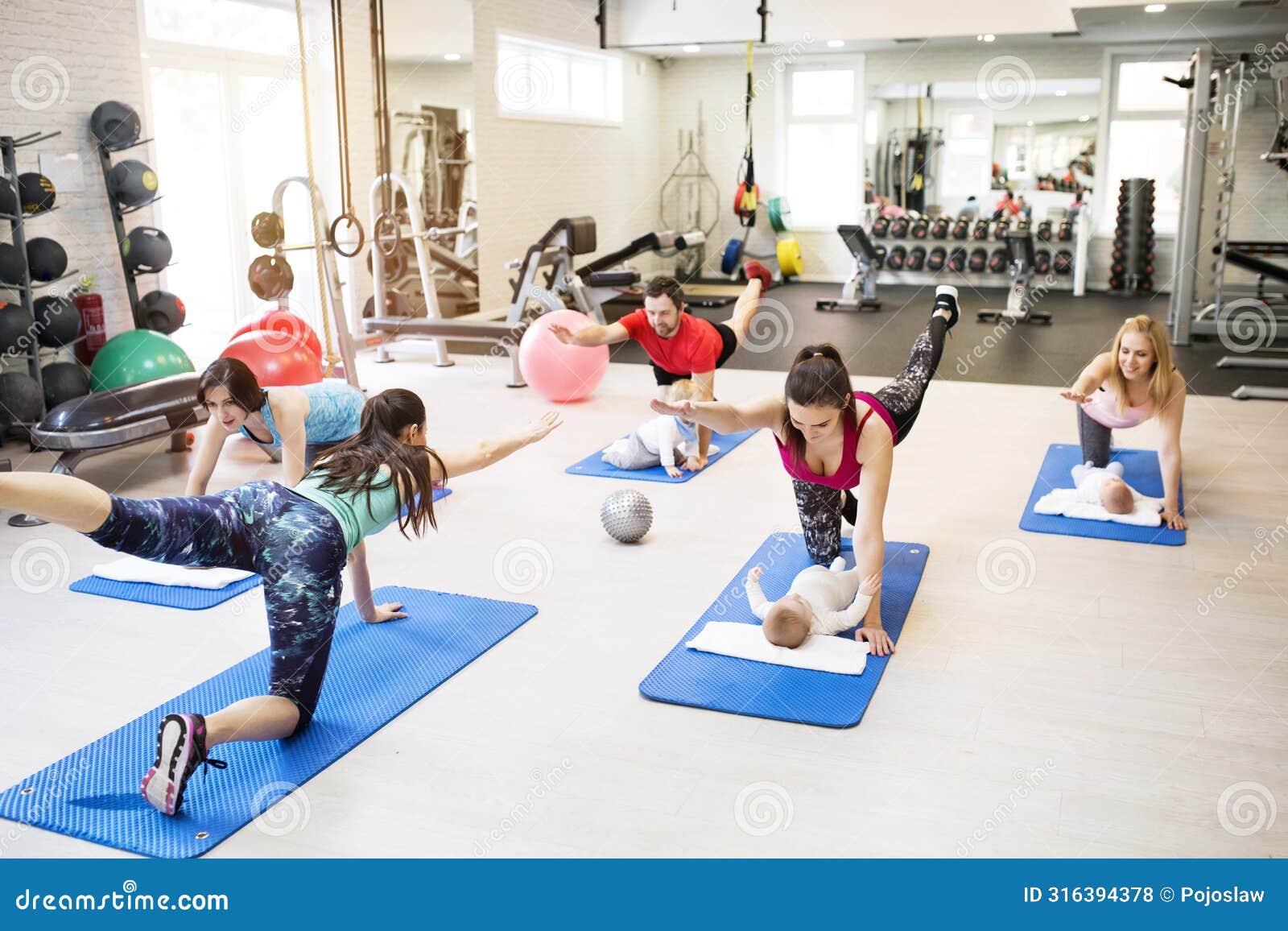 Group Exercise Class, Mother Working Out with Baby in Gym. Moms Staying ...