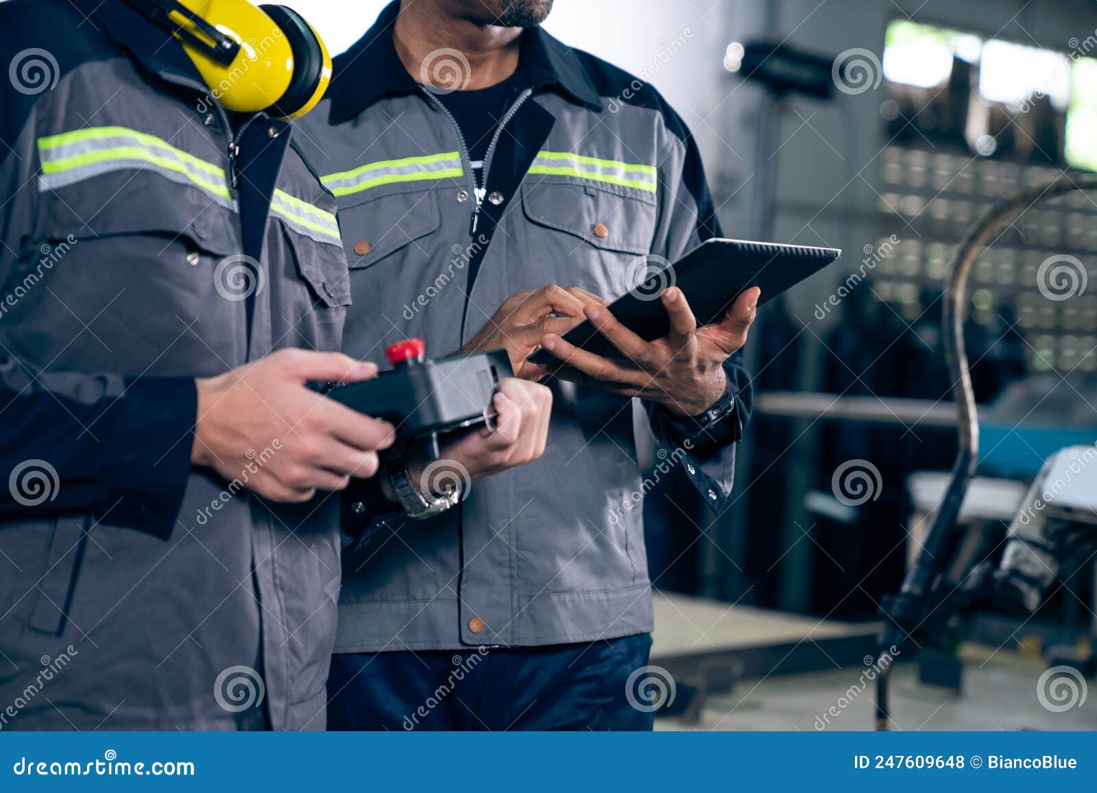 Group of Factory Job Workers Using Adept Machine Equipment in a ...