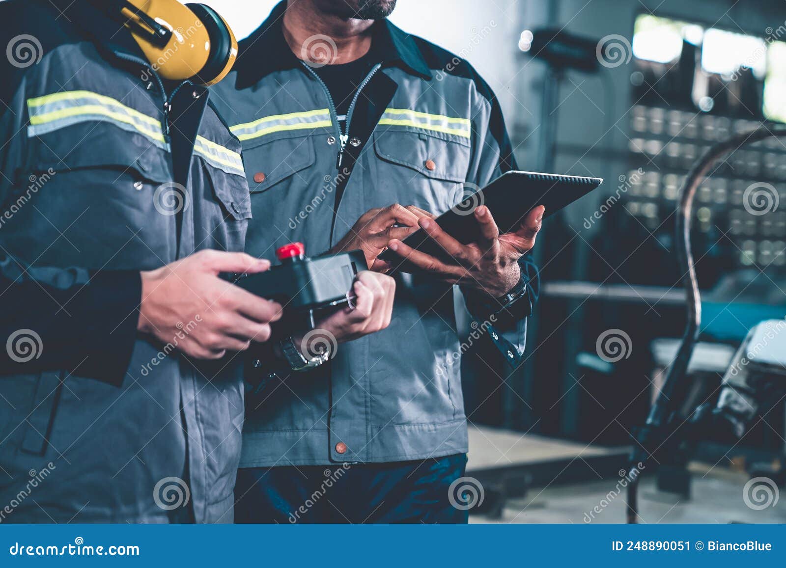 Group of Factory Job Workers Using Adept Machine Equipment in a ...