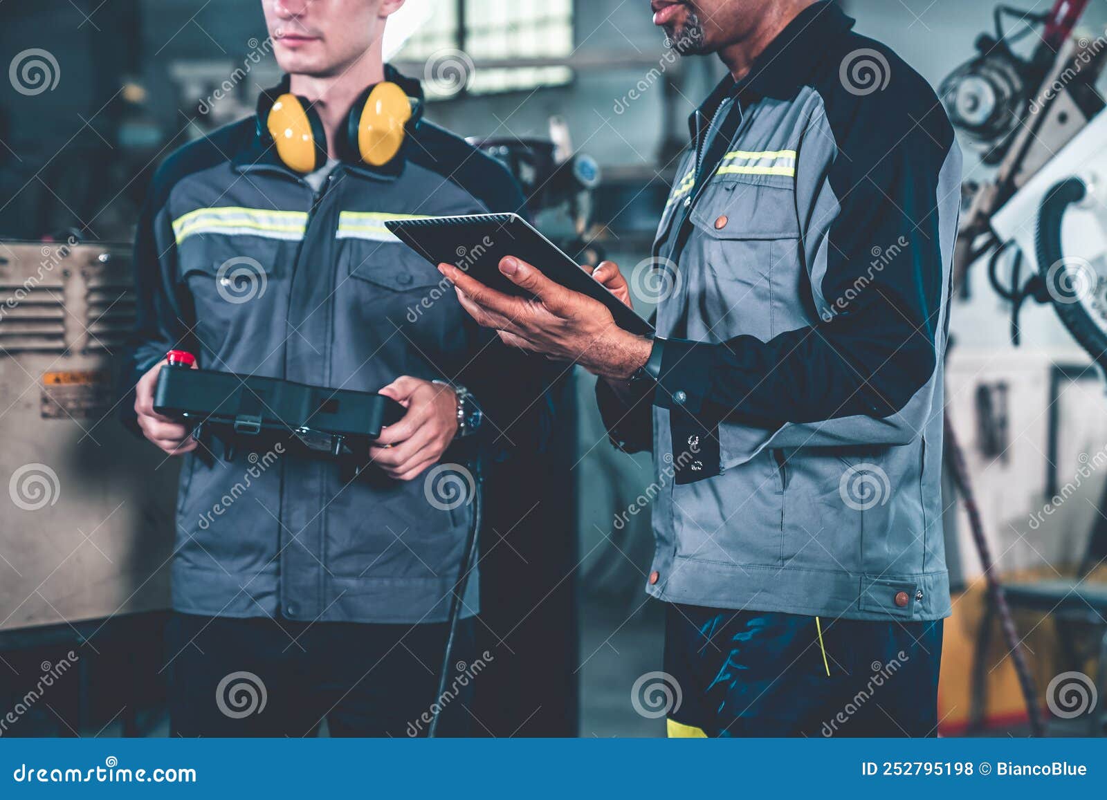 Group of Factory Job Workers Using Adept Machine Equipment in a ...