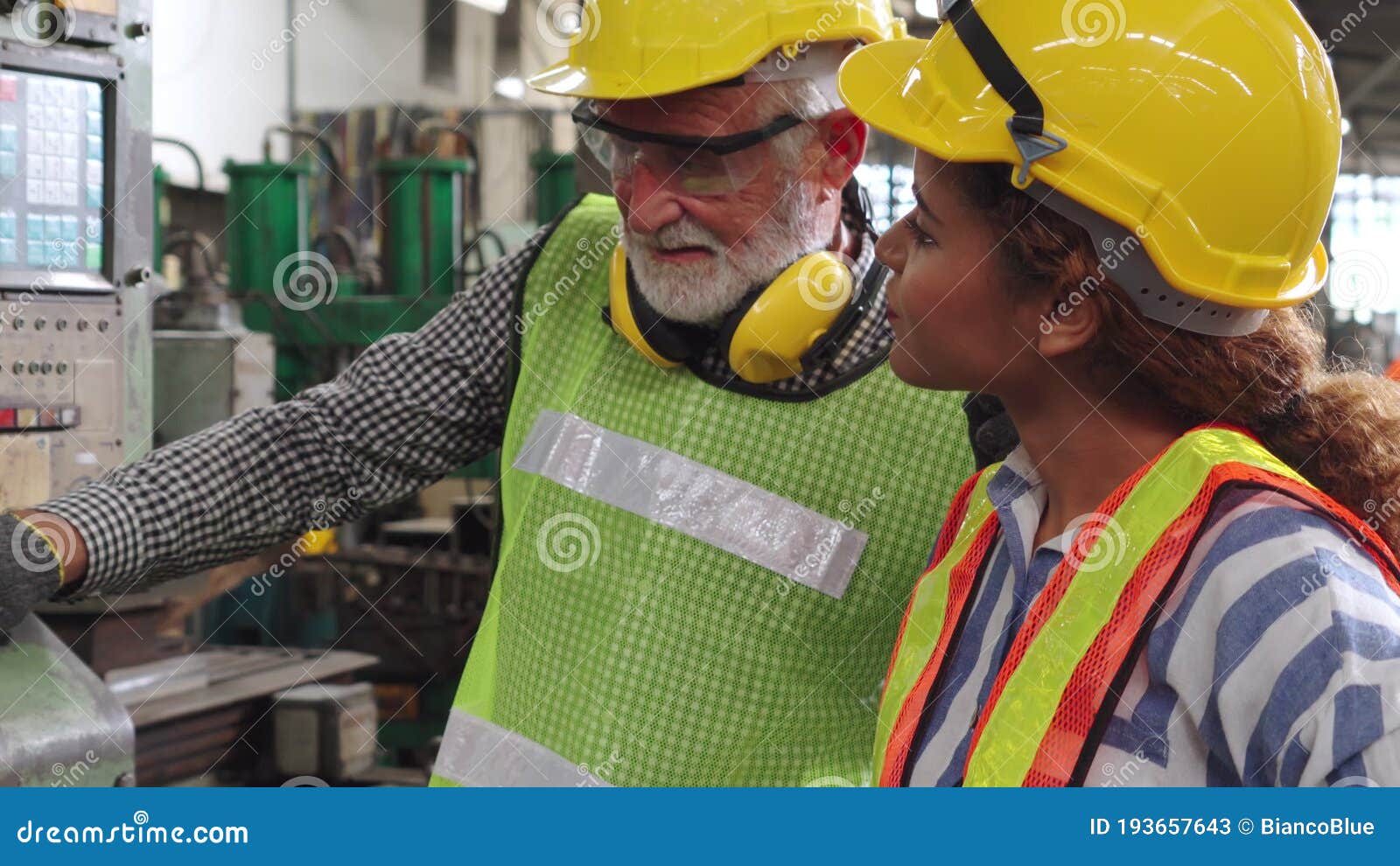Group of Factory Workers Using Machine Equipment in Factory Workshop ...
