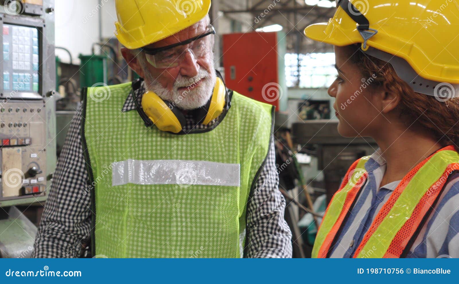 Group of Factory Workers Using Machine Equipment in Factory Workshop ...