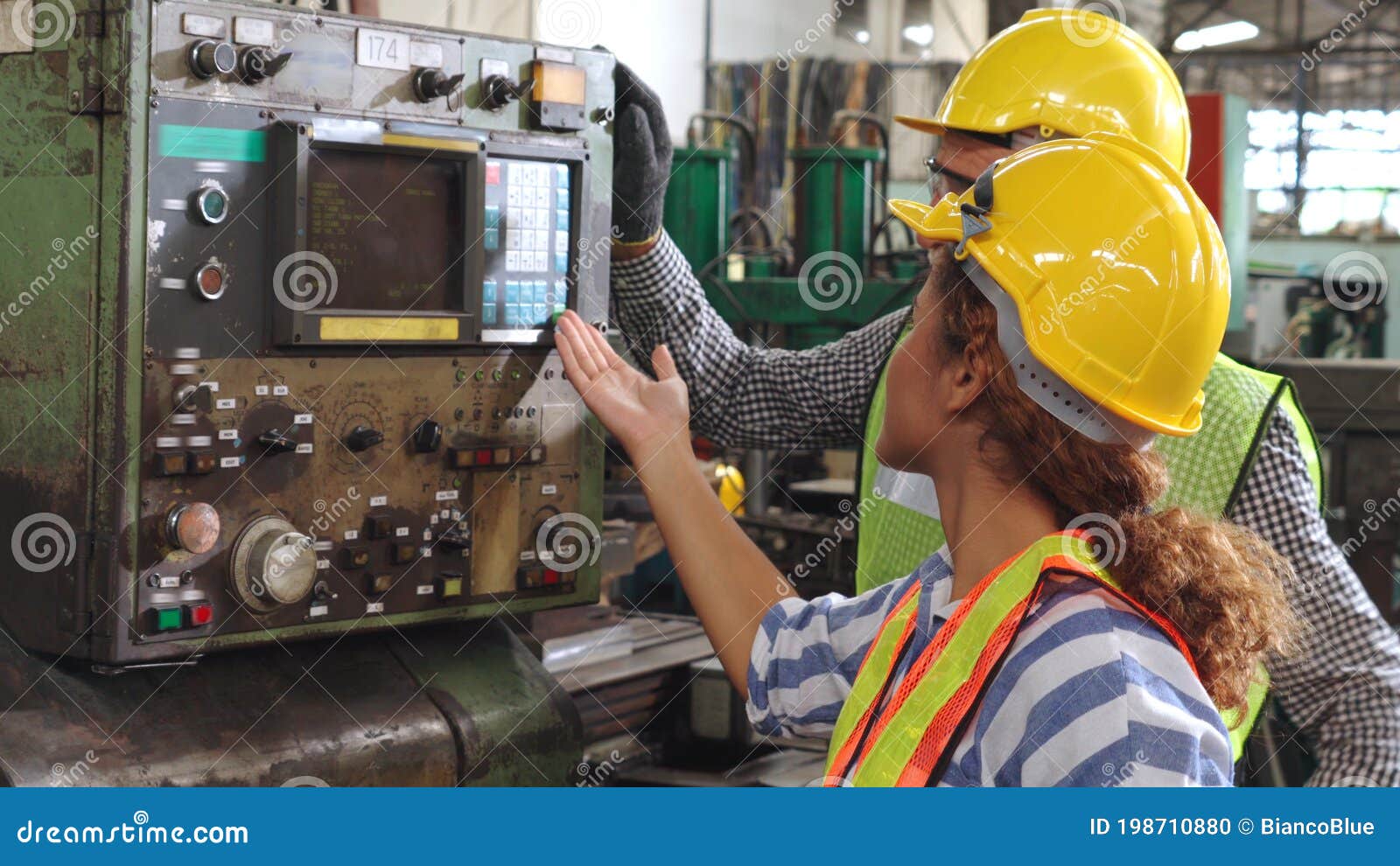 Group of Factory Workers Using Machine Equipment in Factory Workshop ...