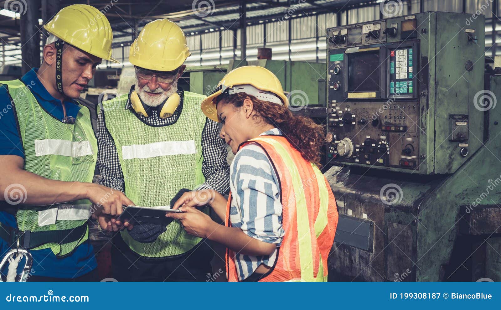 Group of Factory Workers Using Machine Equipment in Factory Workshop ...