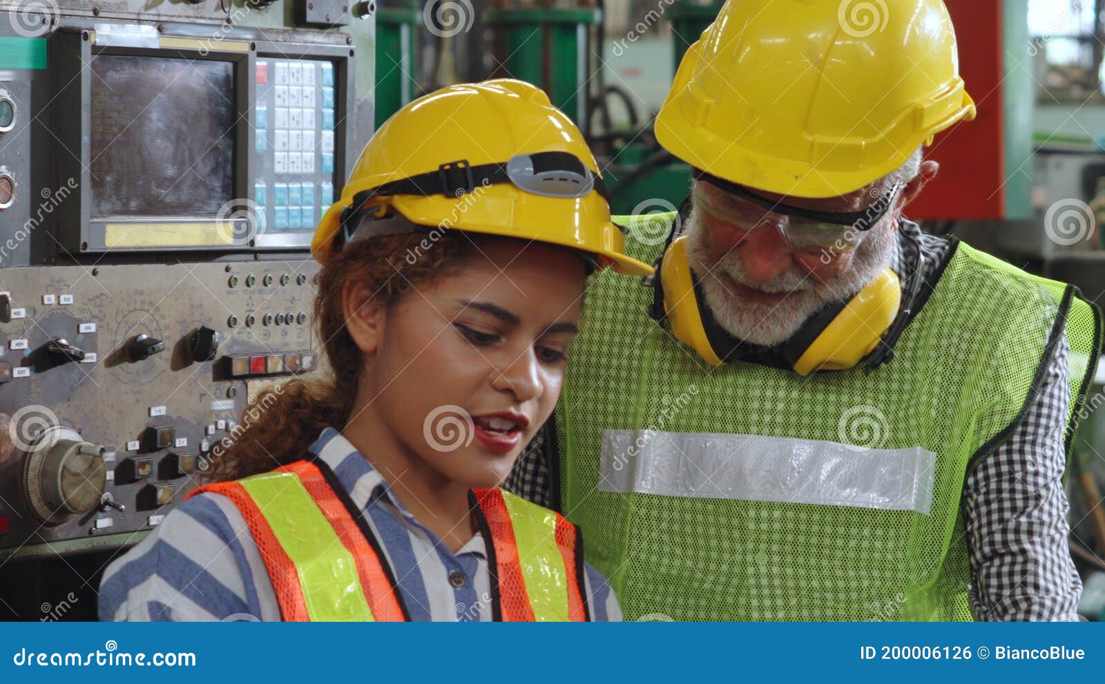 Group of Factory Workers Using Machine Equipment in Factory Workshop ...