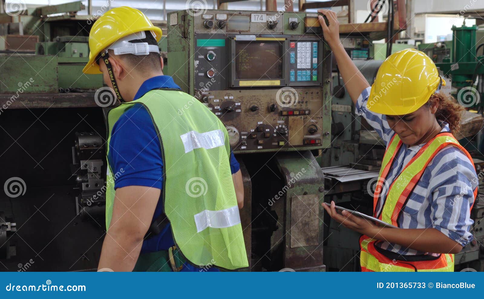 Group of Factory Workers Using Machine Equipment in Factory Workshop ...