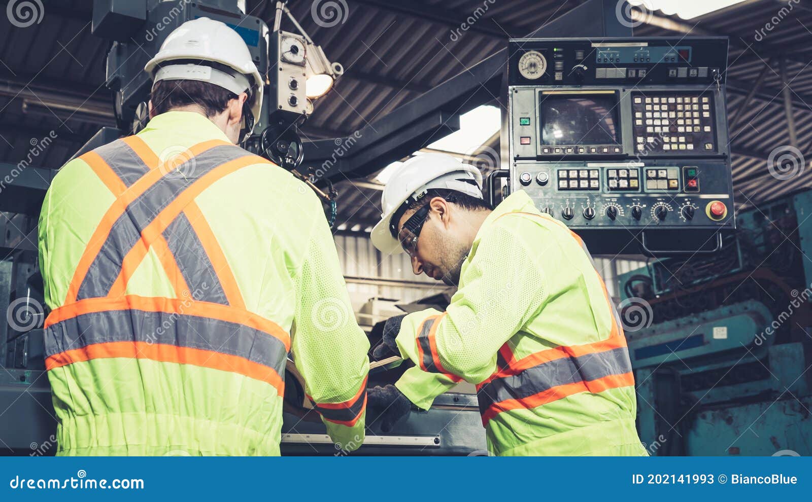 Group of Factory Workers Using Machine Equipment in Factory Workshop ...