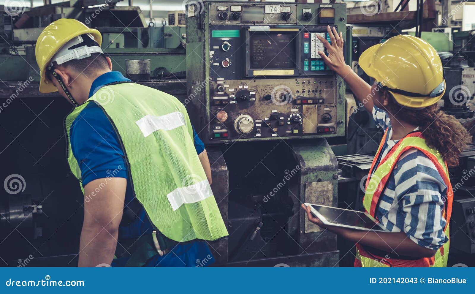 Group of Factory Workers Using Machine Equipment in Factory Workshop ...
