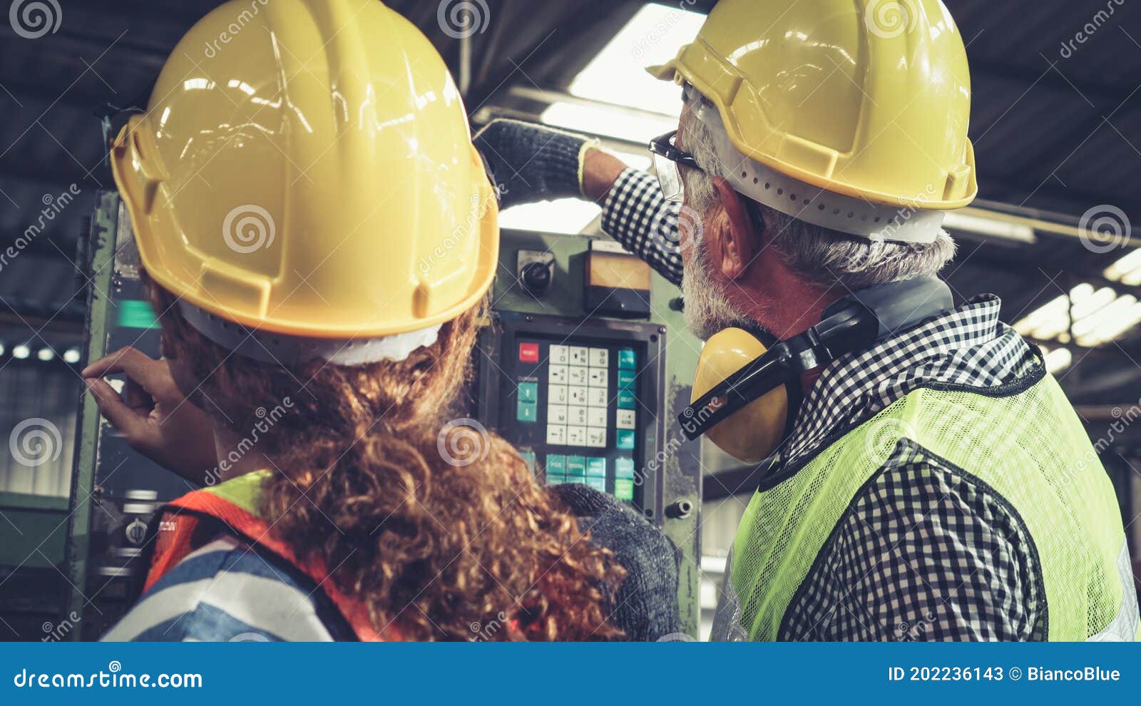 Group of Factory Workers Using Machine Equipment in Factory Workshop ...