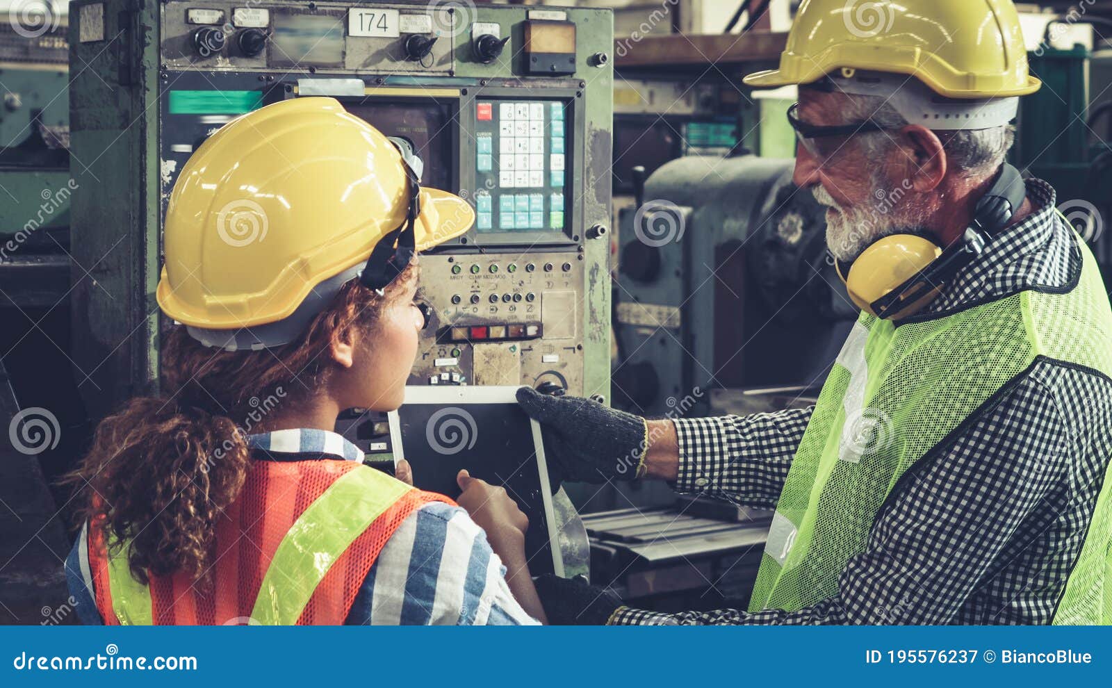 Group of Factory Workers Using Machine Equipment in Factory Workshop ...