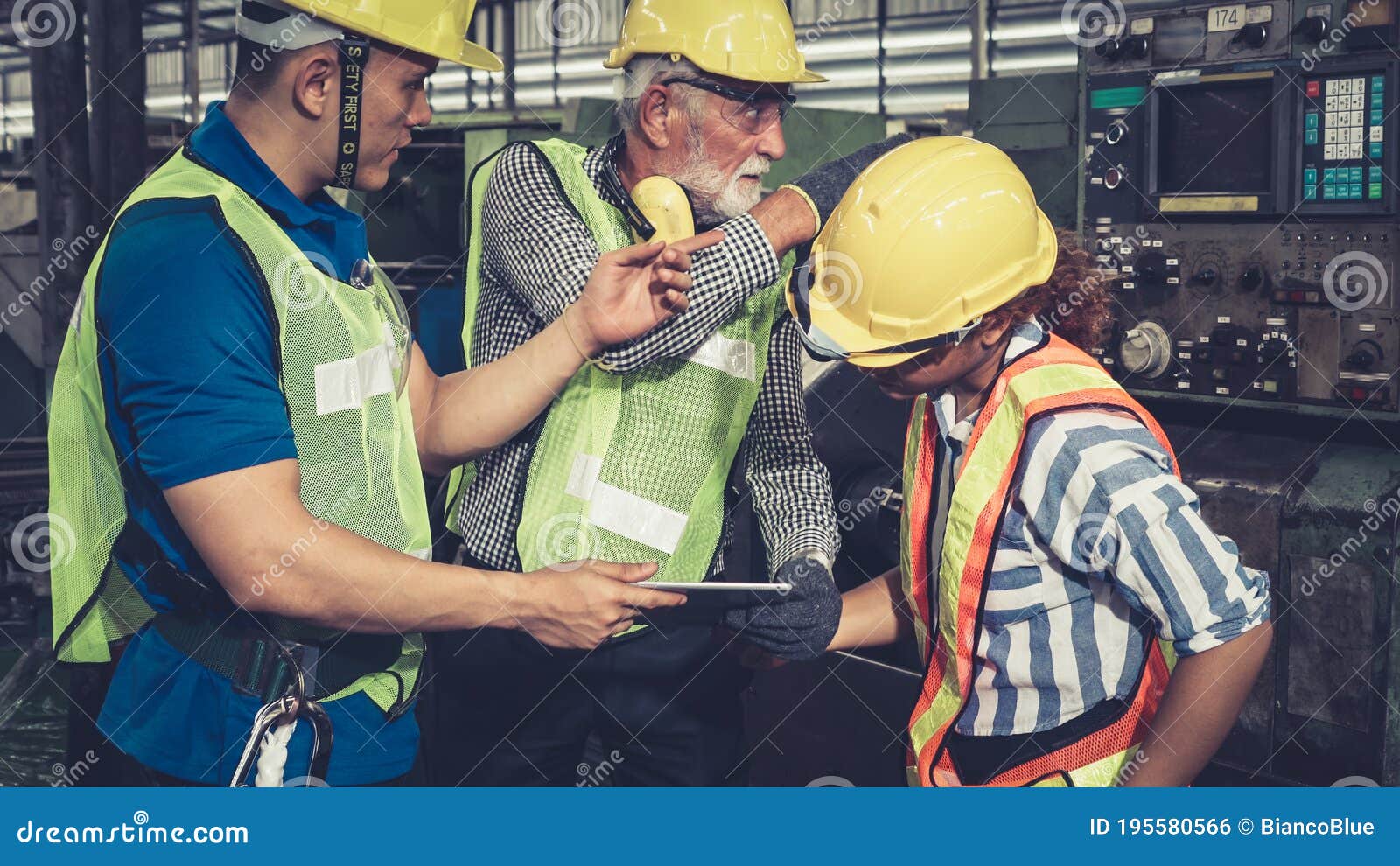 Group of Factory Workers Using Machine Equipment in Factory Workshop ...