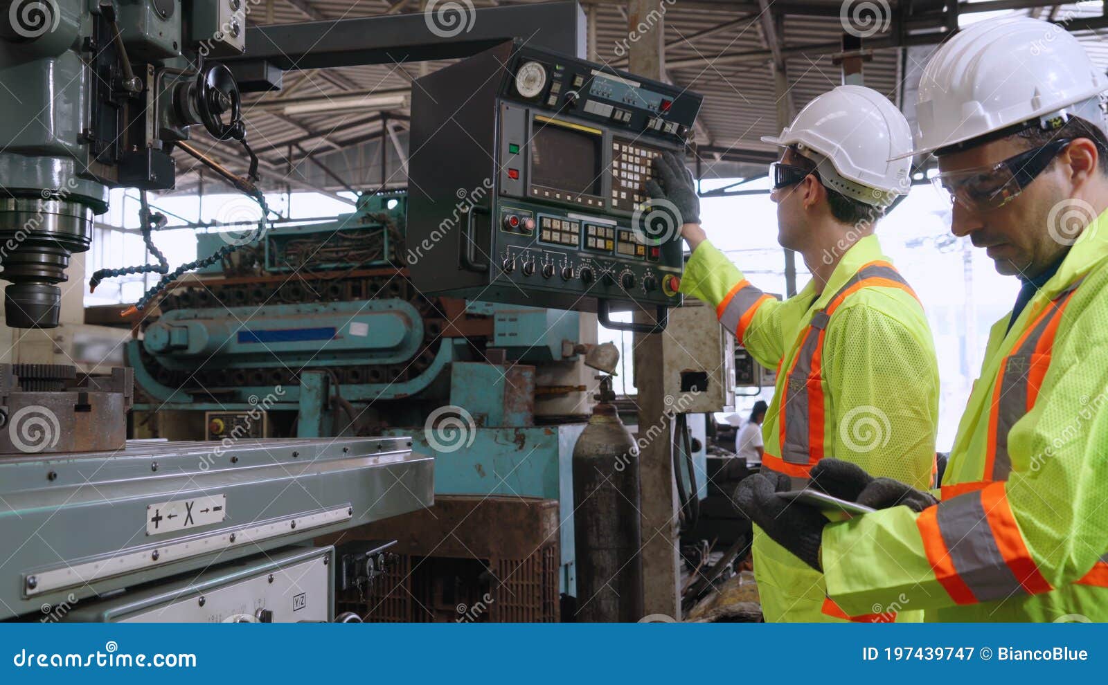 Group of Factory Workers Using Machine Equipment in Factory Workshop ...