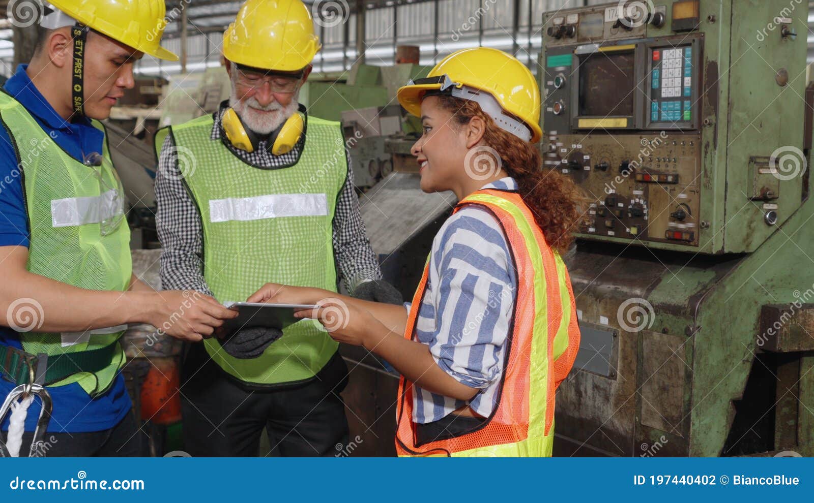 Group of Factory Workers Using Machine Equipment in Factory Workshop ...