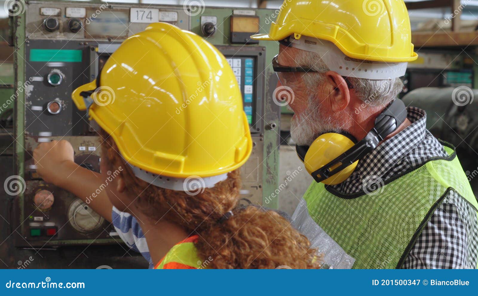 Group of Factory Workers Using Machine Equipment in Factory Workshop ...