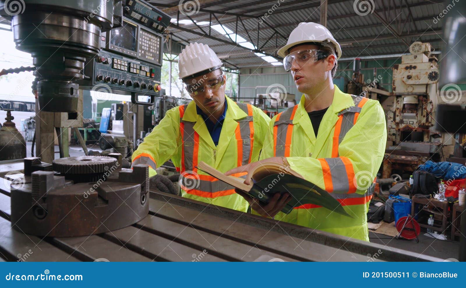 Group of Factory Workers Using Machine Equipment in Factory Workshop ...